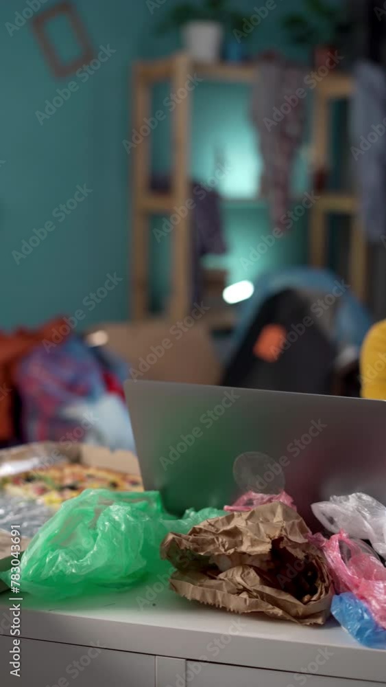 Young man sleeping on Messy desk with piles of garbage and disorganized ...