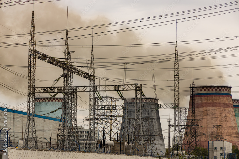 Cooling towers or chimneys of a coal fired power plant with pylons ...