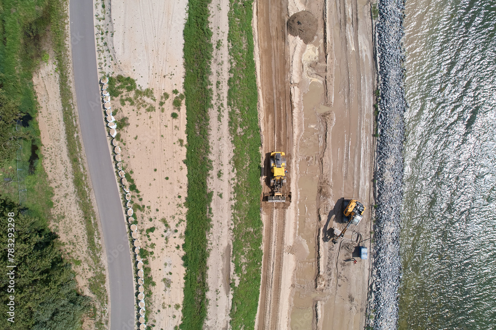 Seawall dyke construction for climate change adaptation - overhead ...