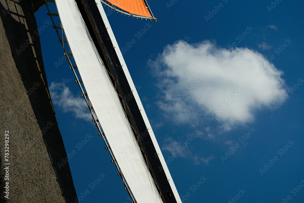 Cloud and Traditional Dutch windmill blade, power by wind sail on vane ...