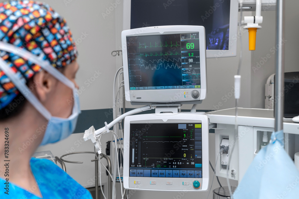 anesthetist monitor screen with vital sign and ECG data of patient ...