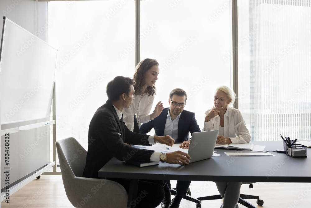 Team sit at desk with laptop, analyzing market trends, review financial ...