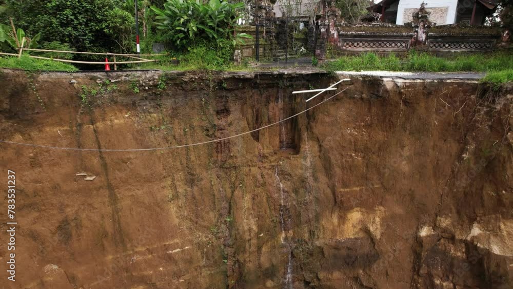 This scene captures close view of edge of steep slope in aftermath of ...