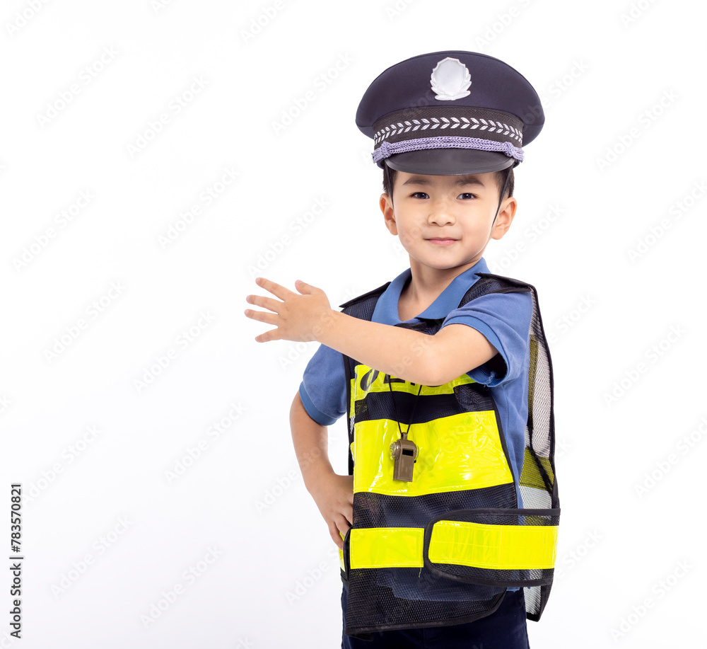 child dressed as a police officer standing before white background ...