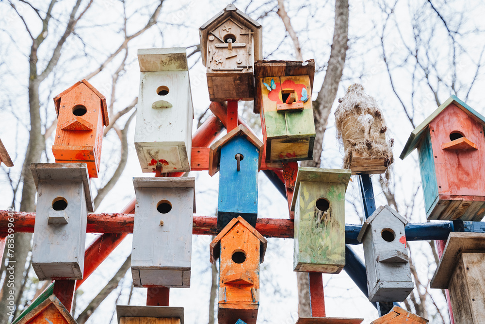 Colorful bird houses form a stacked building with unique facades Stock ...