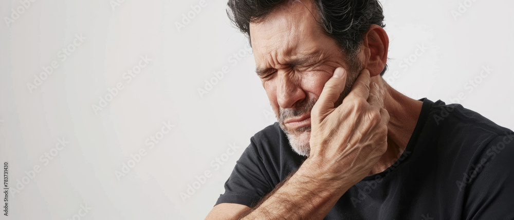 Sad Middle aged man in distress pain in his wrist due to arthritis pain ...