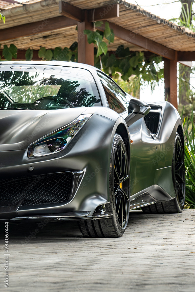 Matte Black Ferrari 488 Pista front side view, headlight focused shot ...