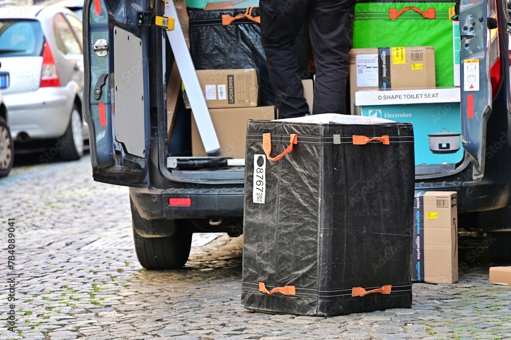 Amazon parcel delivery service truck at work on city roads Turin Italy ...