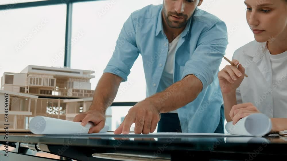 Smart engineer using project plan explain house model construction to ...