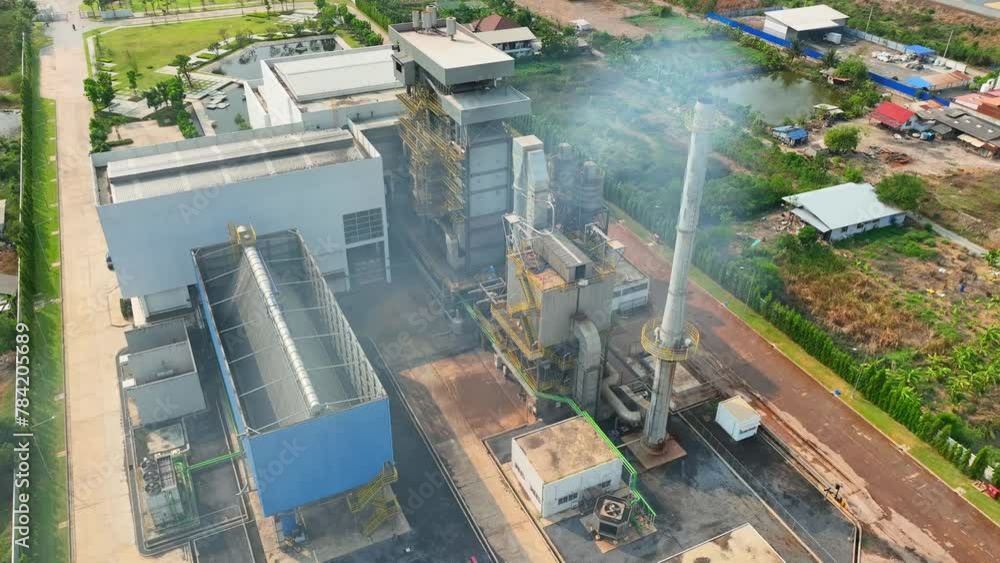 Aerial vista unveils a bustling landfill power plant, converting waste into energy. Drones ...