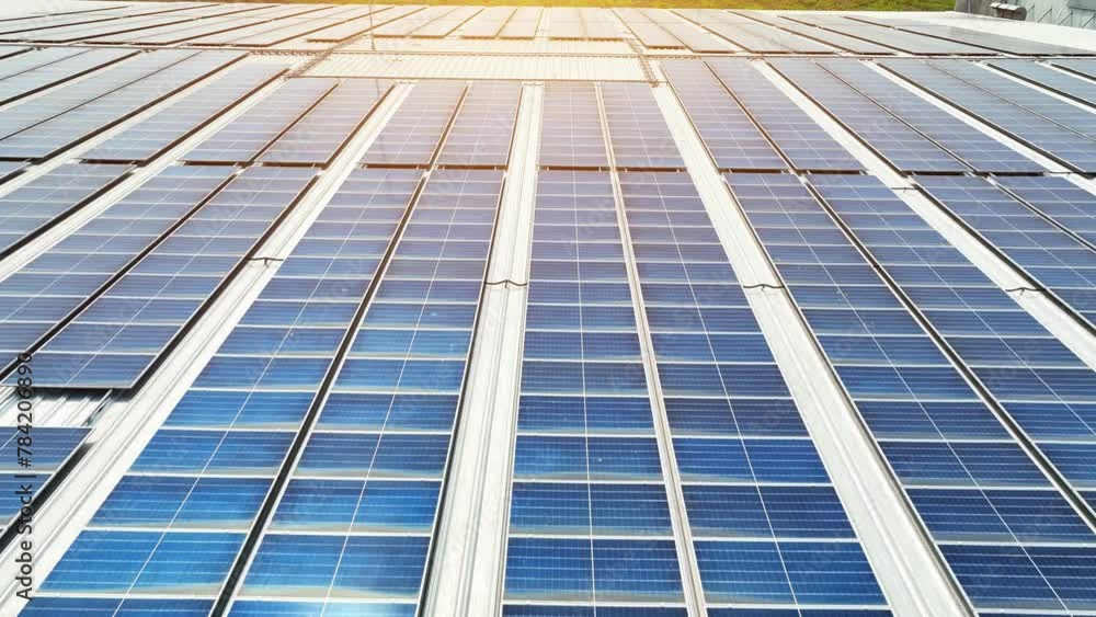The rooftop boasts orderly arrays of sleek blue solar panels ...