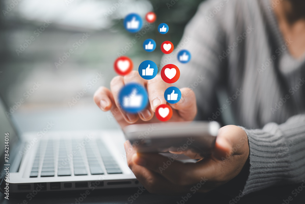 Person used their smartphone to comment, like posts on social media ...