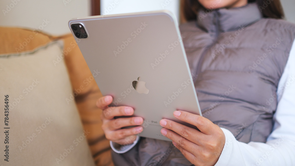 Mar 30th 2024 : A woman holding and using Apple New Ipad Pro digital ...