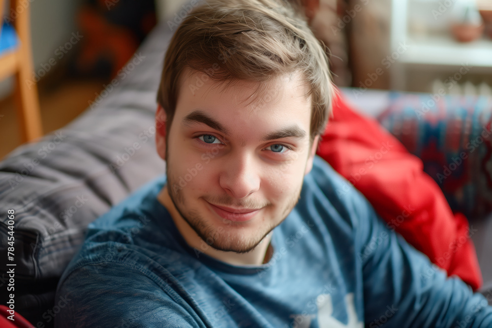 A 20-year-old German man with short brown hair and blue eyes is sitting ...