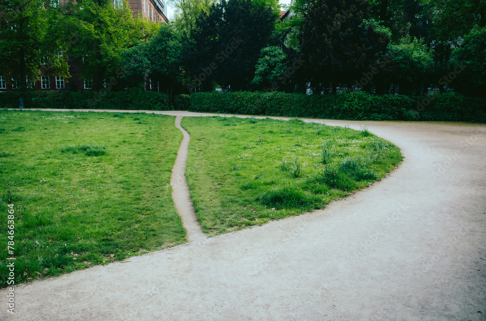 Desire Path in Park - A worn grass desire path splits off from a main ...