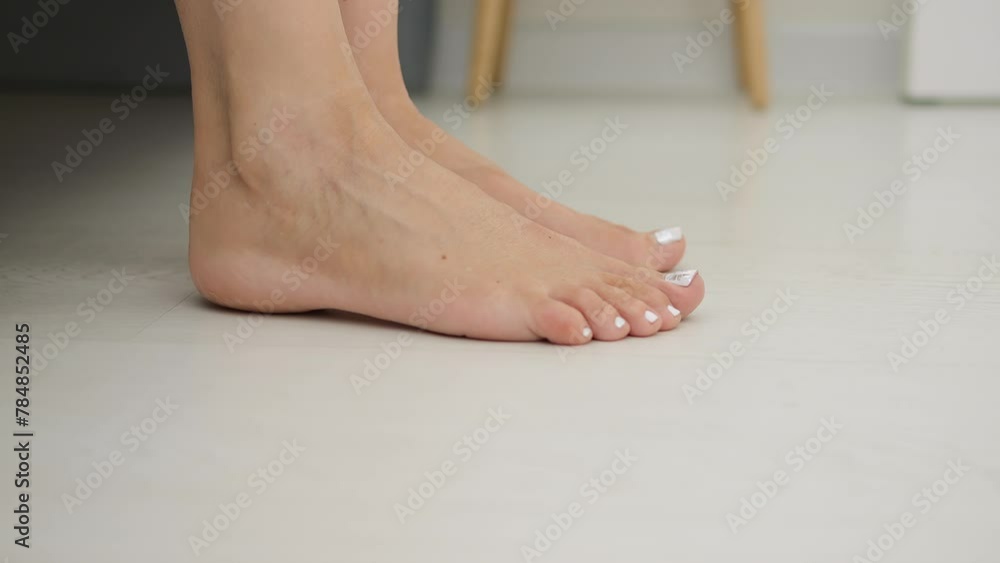 Morning unfolds as female feet gracefully descend from bed, embracing ...