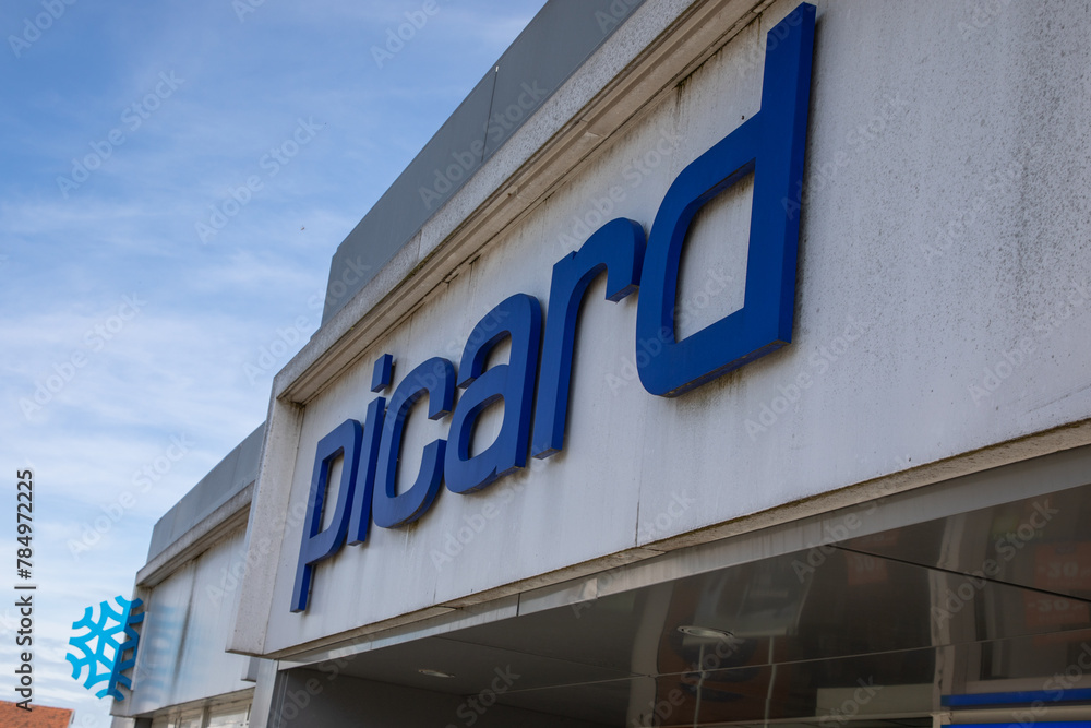 Picard logo brand and text sign on wall facade store French food market ...