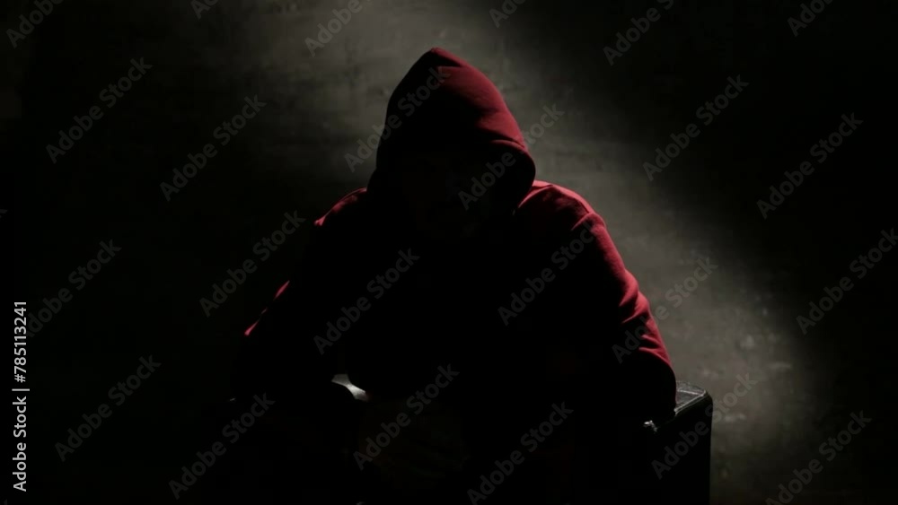 Vidéo Stock Anonymous man in a hood interview video footage. Mysterious ...