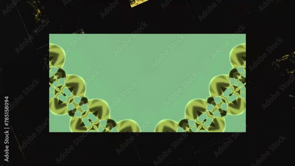 Green rectangle with a decorative pattern of interlocking golden ...