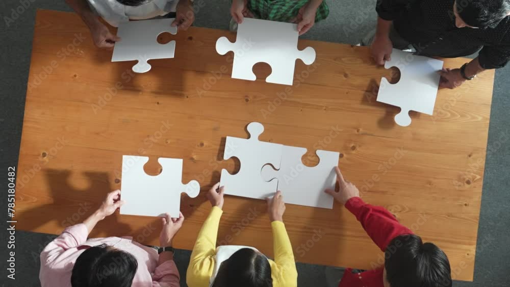 Vidéo Stock Top down view of skilled business people assemble jigsaw ...