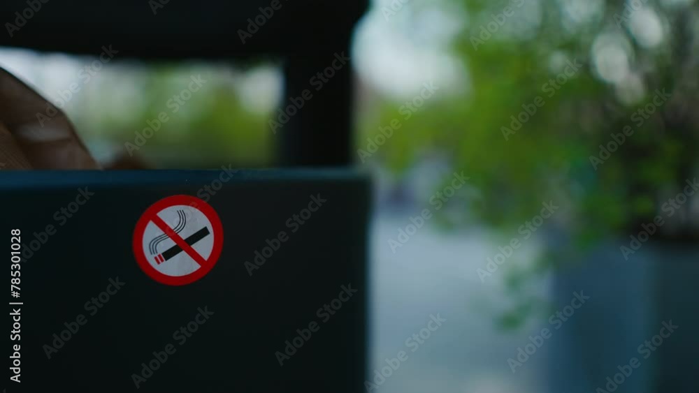 No Smoking Near Bin: A cautionary sign adjacent to the overflowing bin ...
