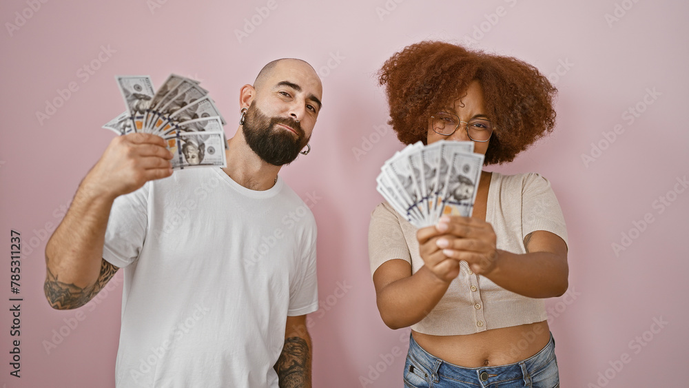 Confident beautiful couple smiling in love, standing together over an ...