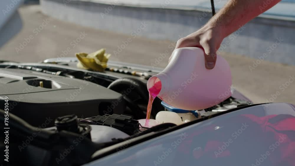 Adding antifreeze to car vital for protecting engine from freezing and ...