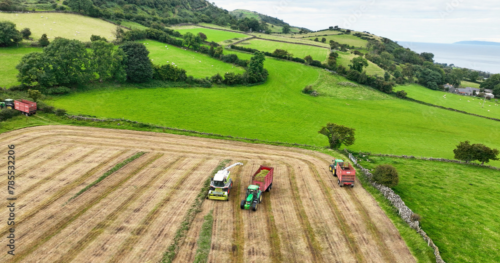 Claas Self Propelled Harvester lifting grass for Silage with a John ...