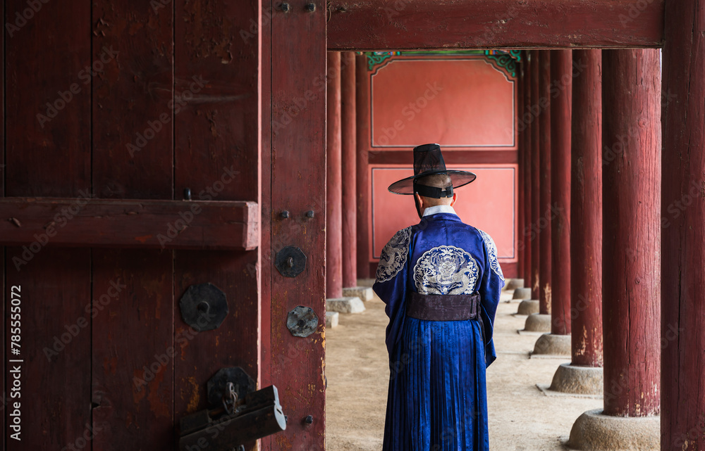 Back view man in Korean hanbok traditional costume walking in ...