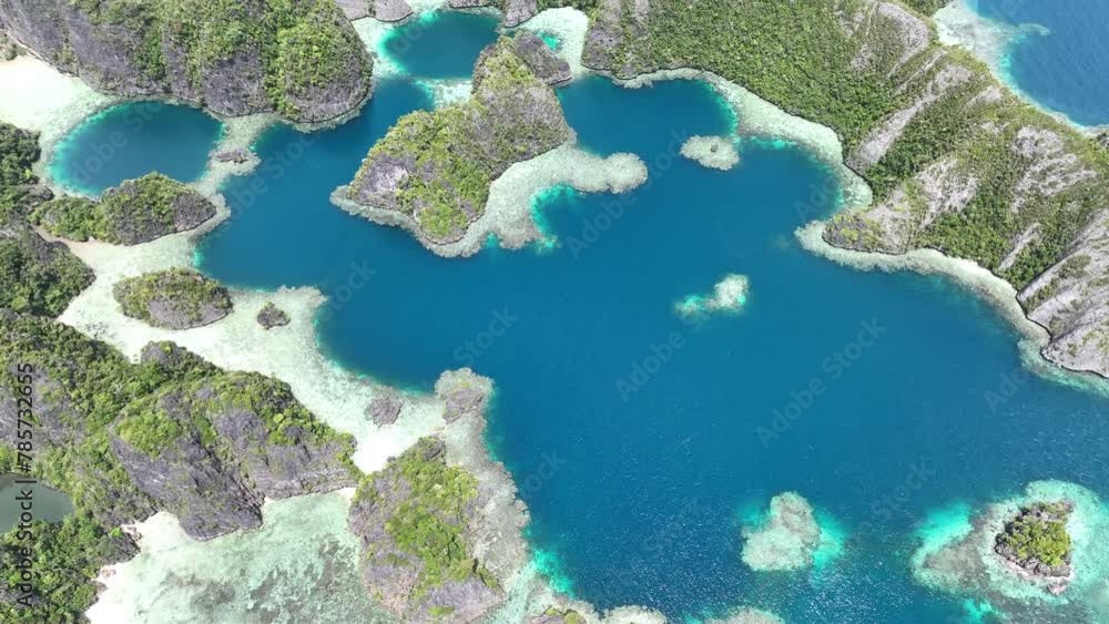 Healthy coral reefs surround rugged islands in Balbalol amid Raja Ampat ...