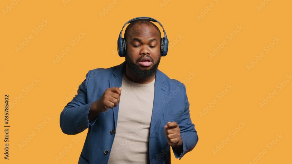 Happy african american person having fun, dancing on rhythm, listening ...
