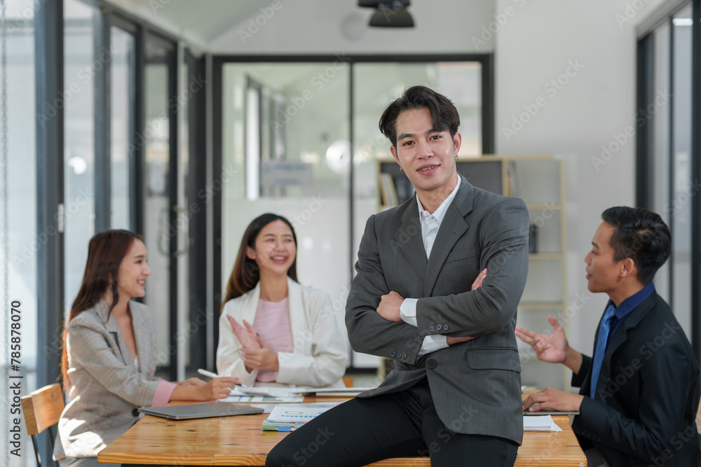 Strong young Asian businessman A muscular man smiles at the camera ...