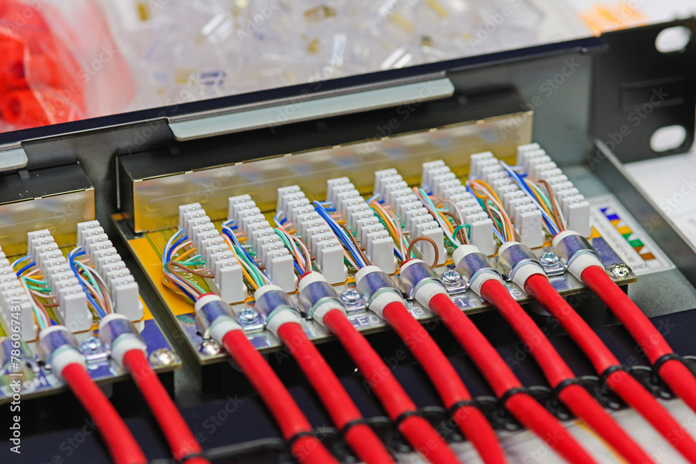 Patch panel with connected twisted pair wires. To connect an Ethernet ...
