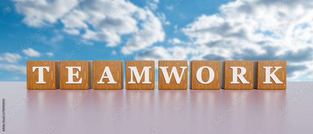 Teamwork. Wooden dices with white capital letters and the word ...