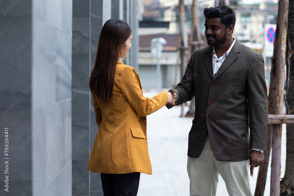 Successful business people handshake - Asian business woman and indian ...