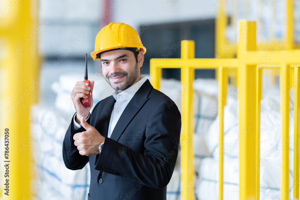 European male business owner of a steel and plastic manufacturing plant ...