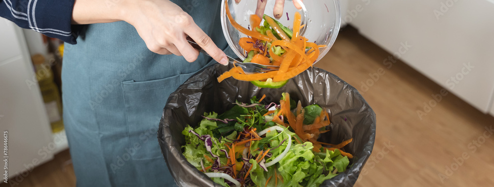 global food pollution concept. Woman throwing a leftover breakfast to ...