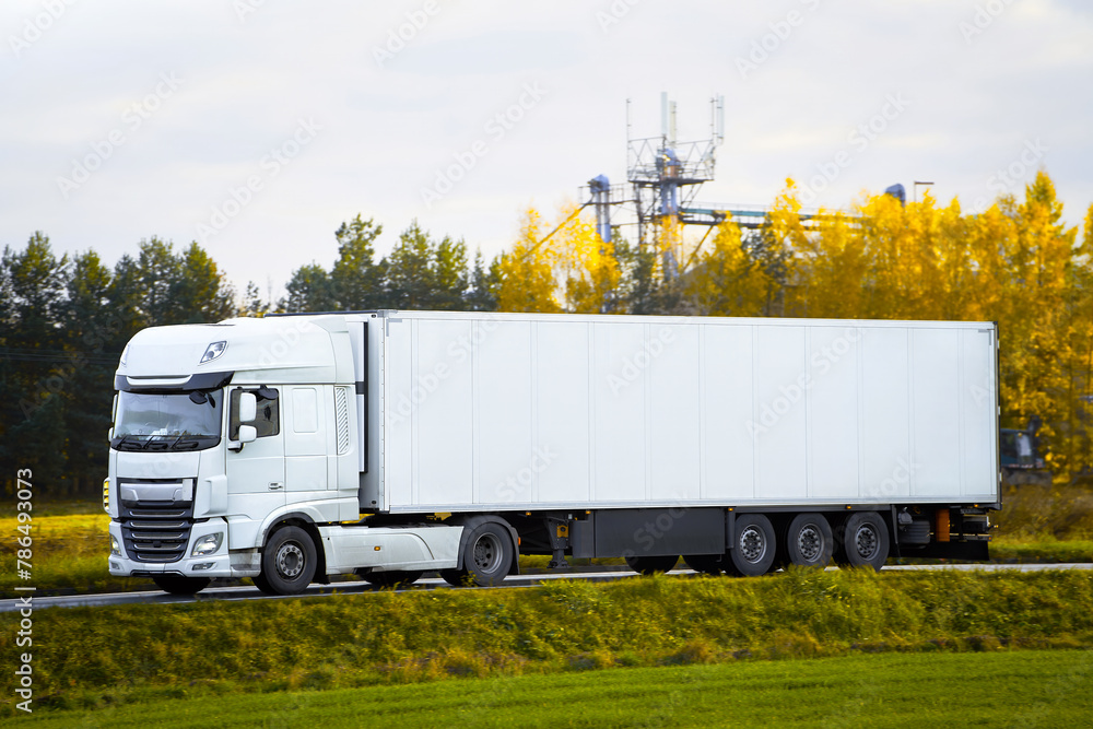 Front-side view of a truck shipping parcels and goods on the highway ...