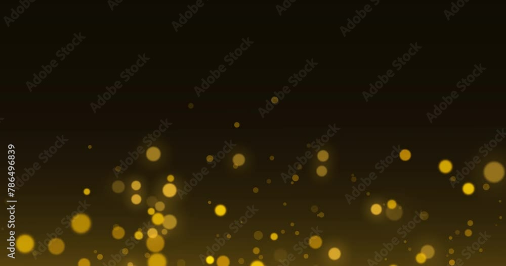 Golden luxury bokeh on particles floating in the air. Dust and glitter particles background ...