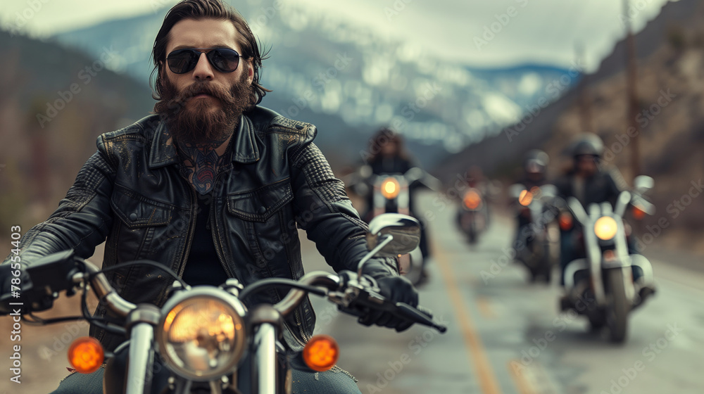 A man with a beard and sunglasses is riding a motorcycle with other ...