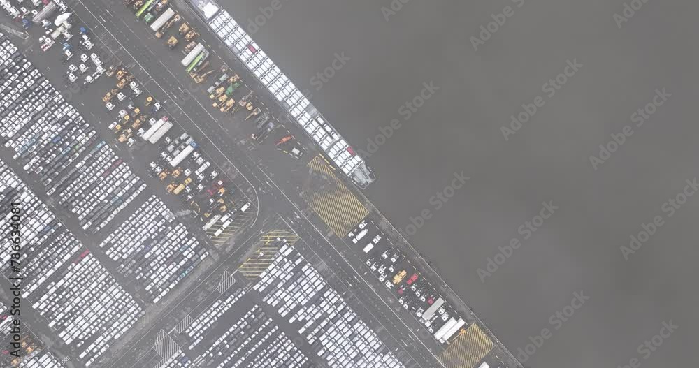 Aerial top down drone views of transportation of vehicles over seas ...