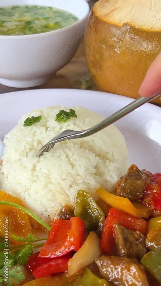 Video Stock Human hand using spoon to eat brown rice with nature. white ...