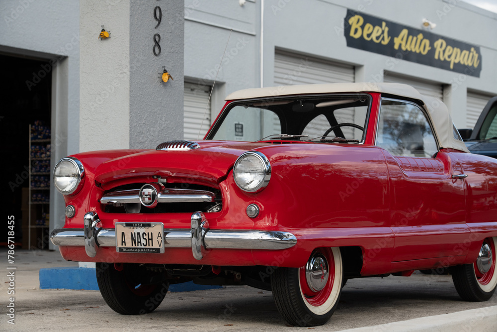 Orlando, Florida, US- April 1, 2024: A shiny red two door 1950 Nash ...