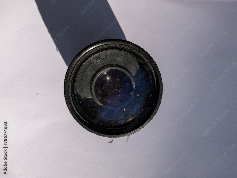 camera lens with fungus in the front element on a white background with ...