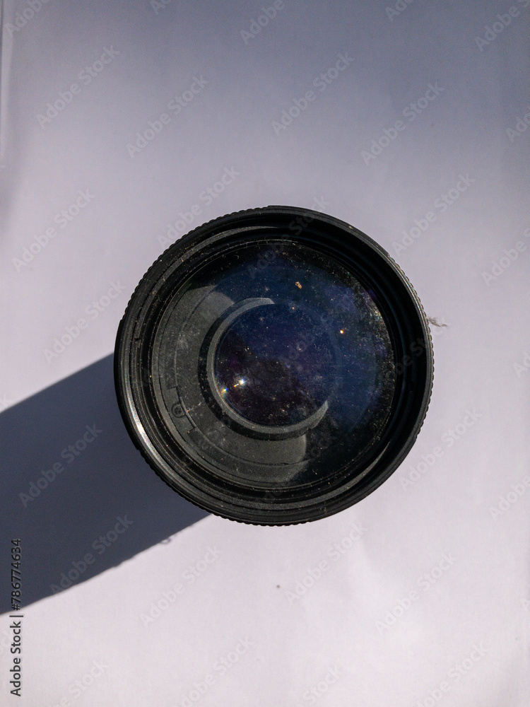 camera lens with fungus in the front element on a white background with ...
