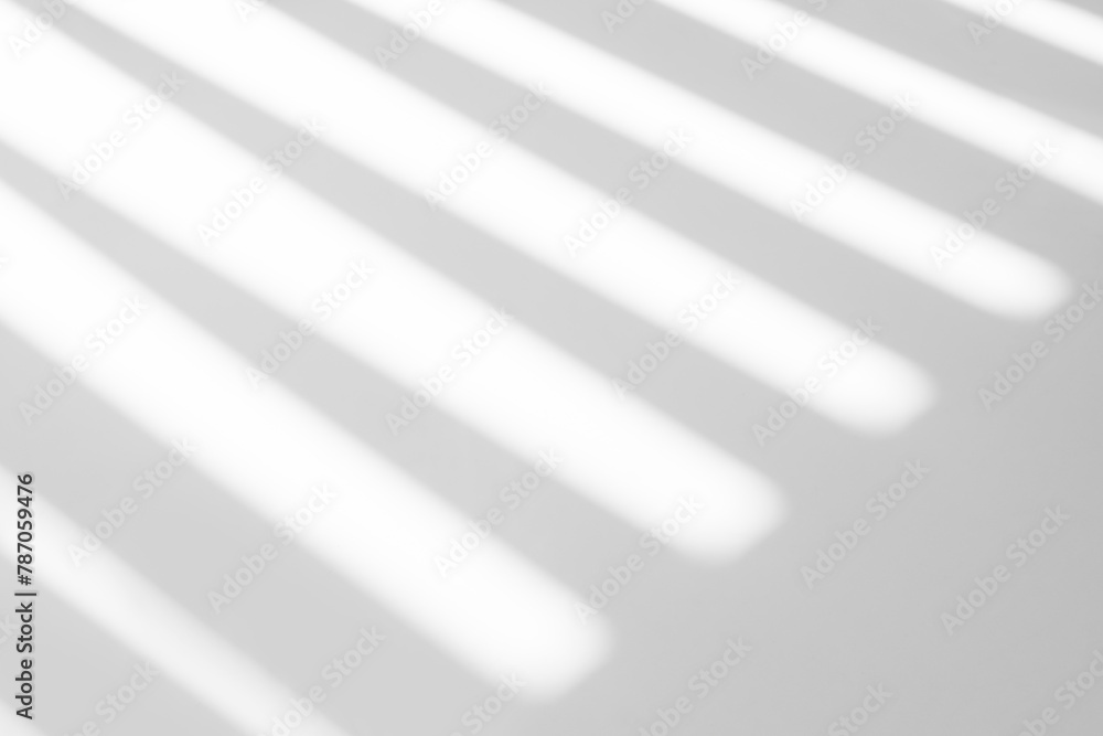 Abstract light reflection and grey shadow from window on white wall ...