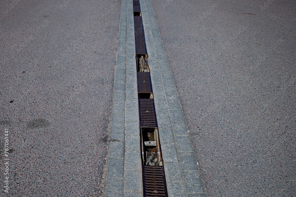 A road with three types of road surface with asphalt paving stones ...
