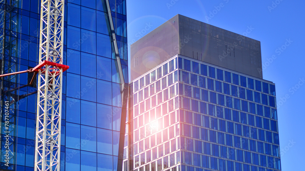 High rise building under construction. Installation of glass facade ...