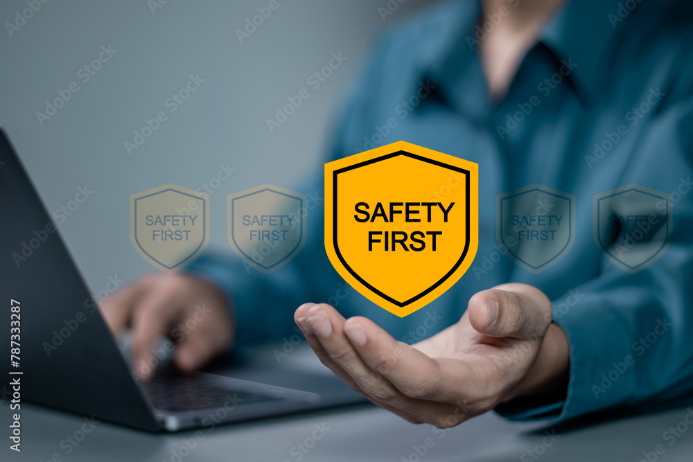 Safety first concept. Businessman using with safety first symbols for ...
