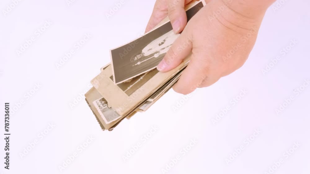 elderly woman looks through his old photographs of 1950-1960, concept ...